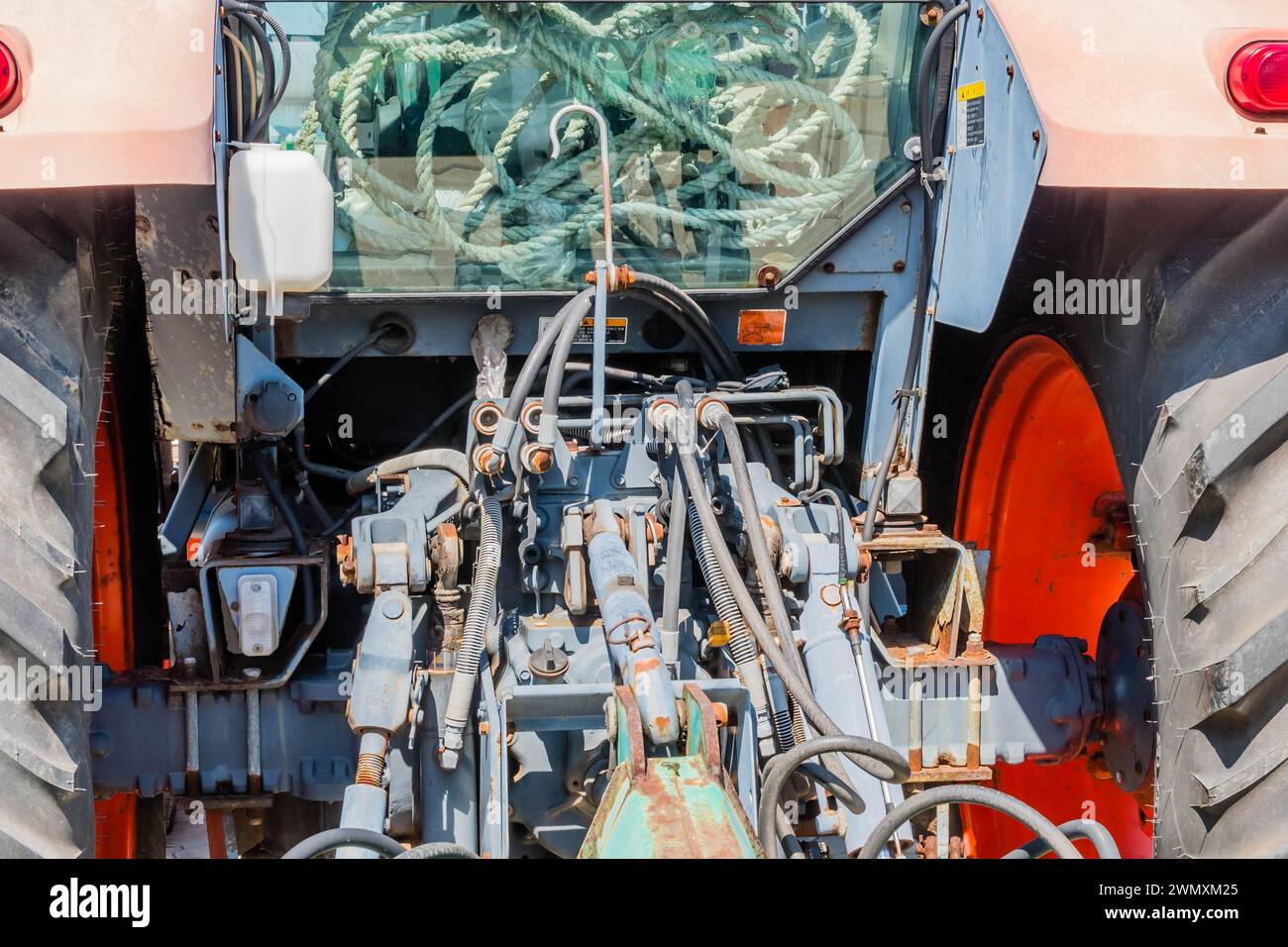 Closeup of hydraulic and pneumatic lines and connectors on rear of ...