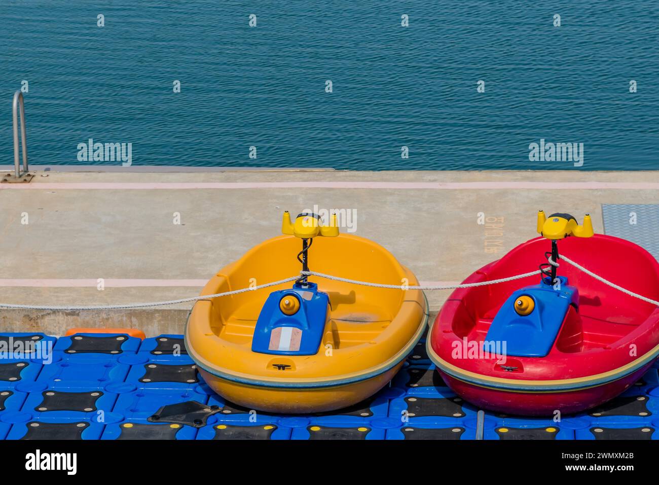 Small electric boats for children on pier of ocean marina in Pyeongtaek ...