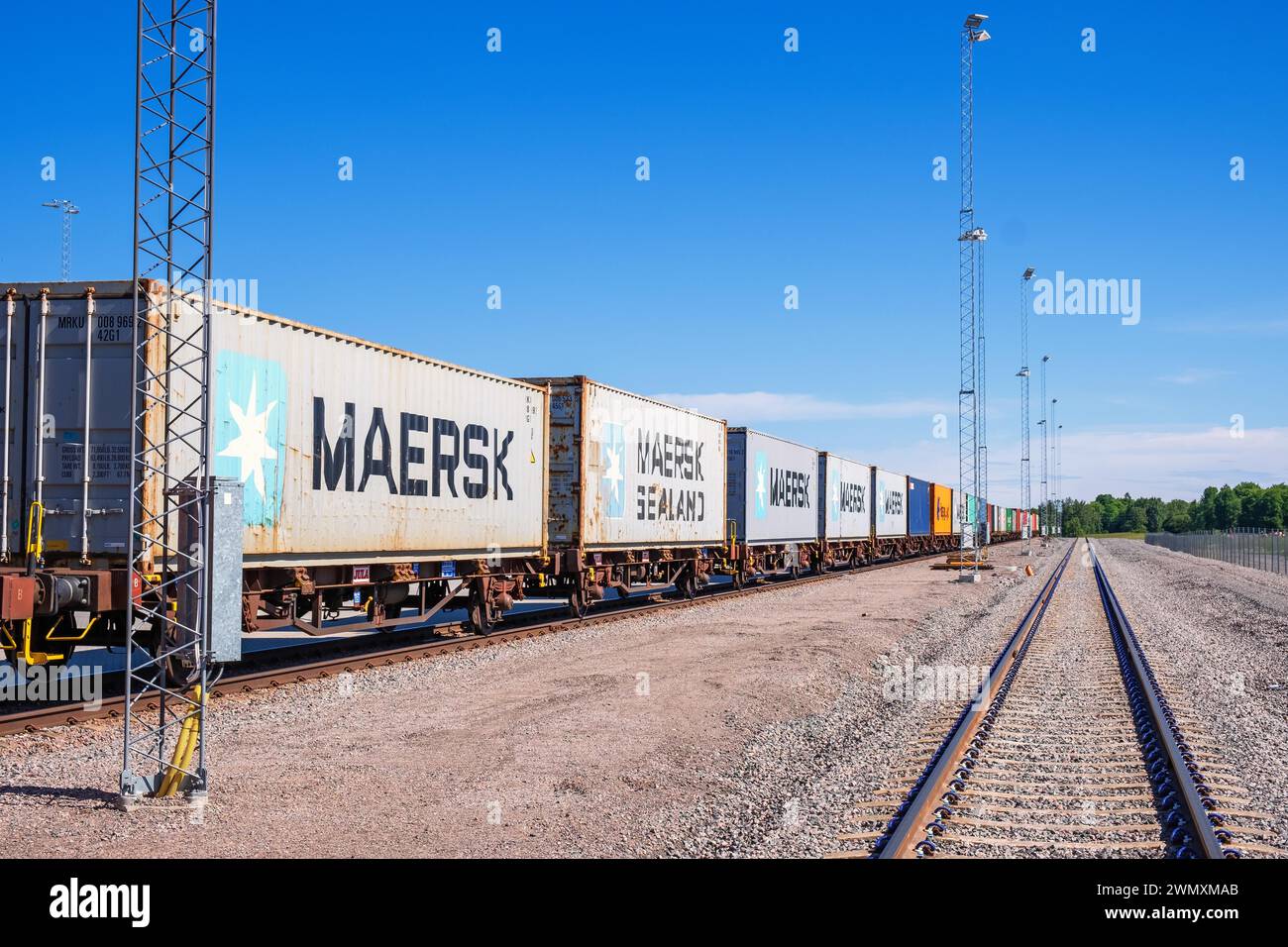 Freight wagons with containers at a freight terminal for rail transport ...