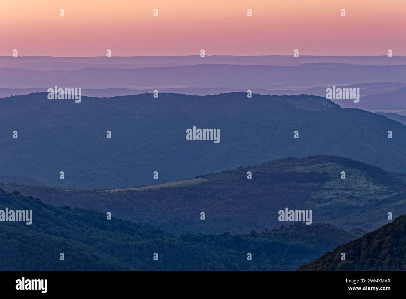 Dawn over the mountain landscape of the Balkan Mountains and the wooded ...