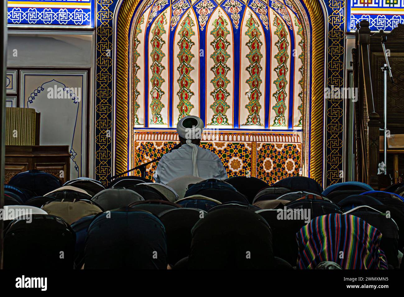Muslims kneeling and bowing down while offering prayers during the ...