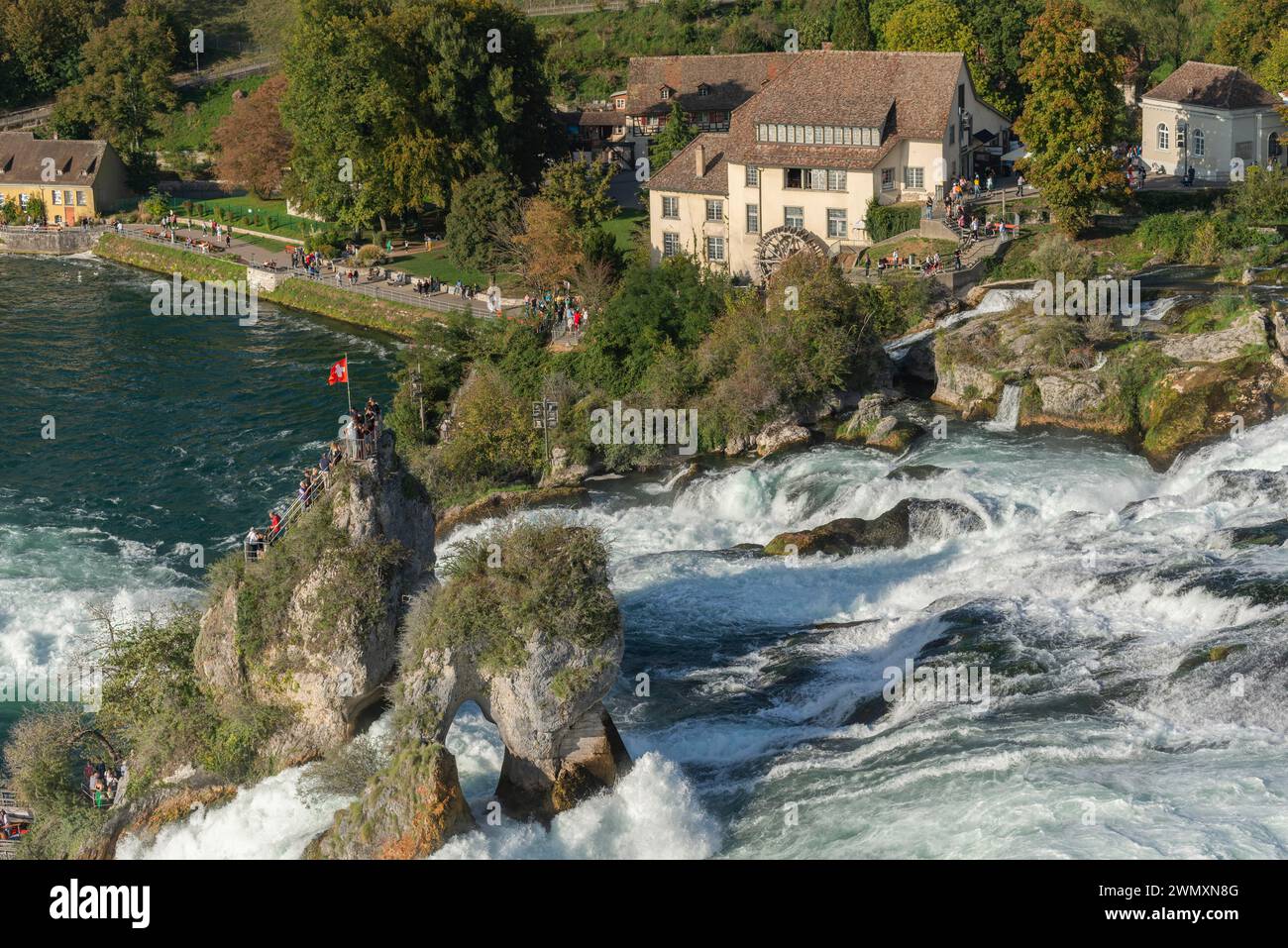 Rhine Falls seen from Laufen Castle, rocky island, Swiss flag, rapids ...