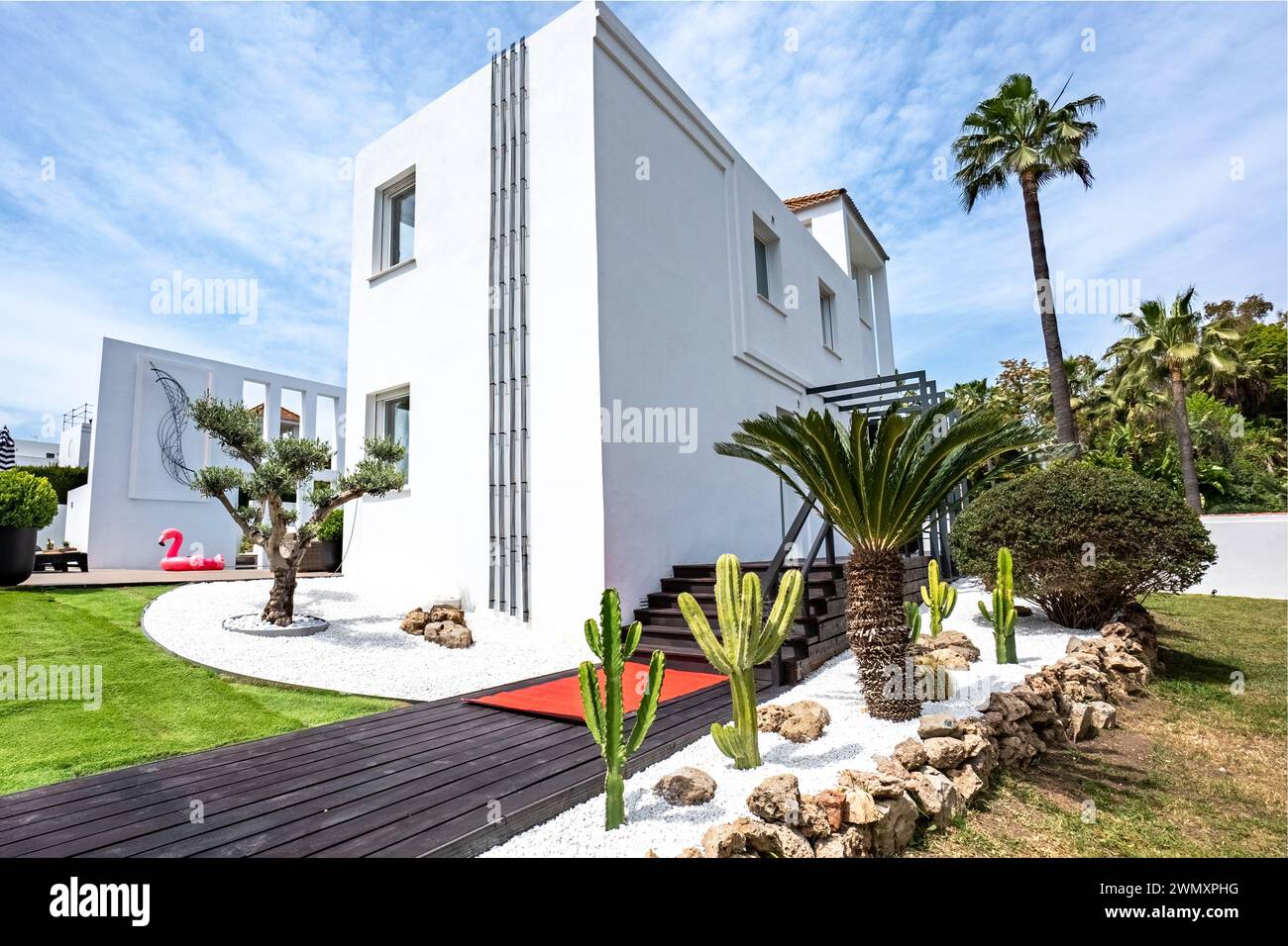 an image of the entrance to a luxury Mediterranean villa filled with ...