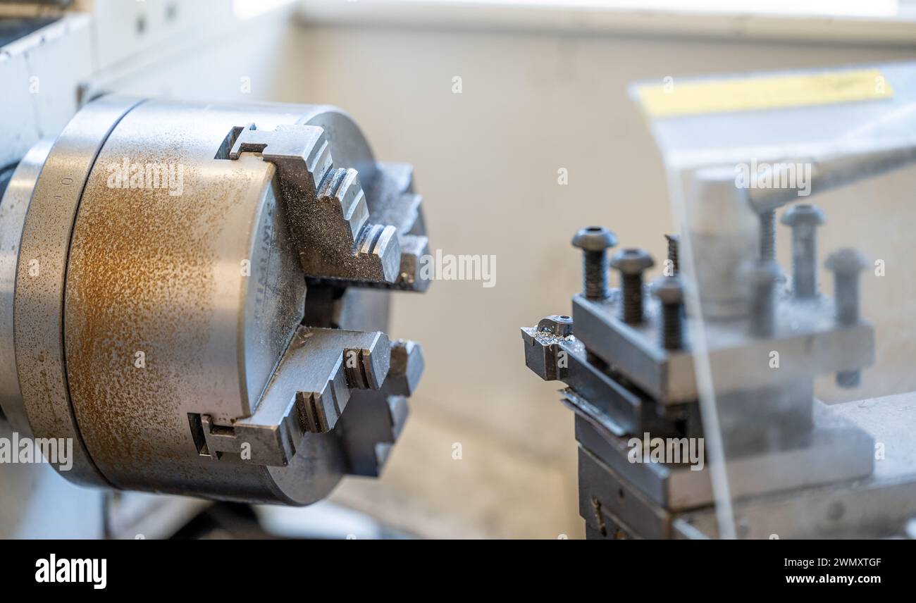 The CNC lathe machine mills slotted spindle parts made of brass and ...