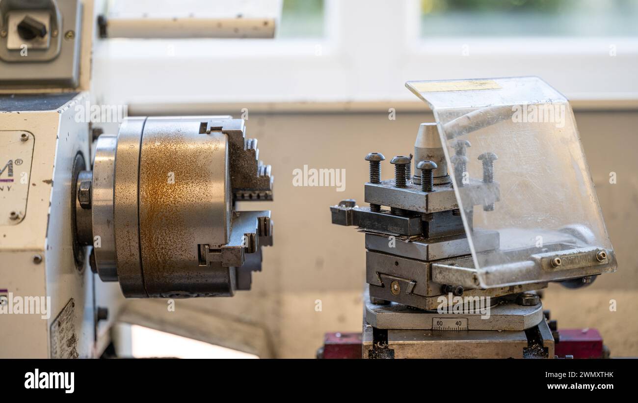 The CNC lathe machine mills slotted spindle parts made of brass and ...