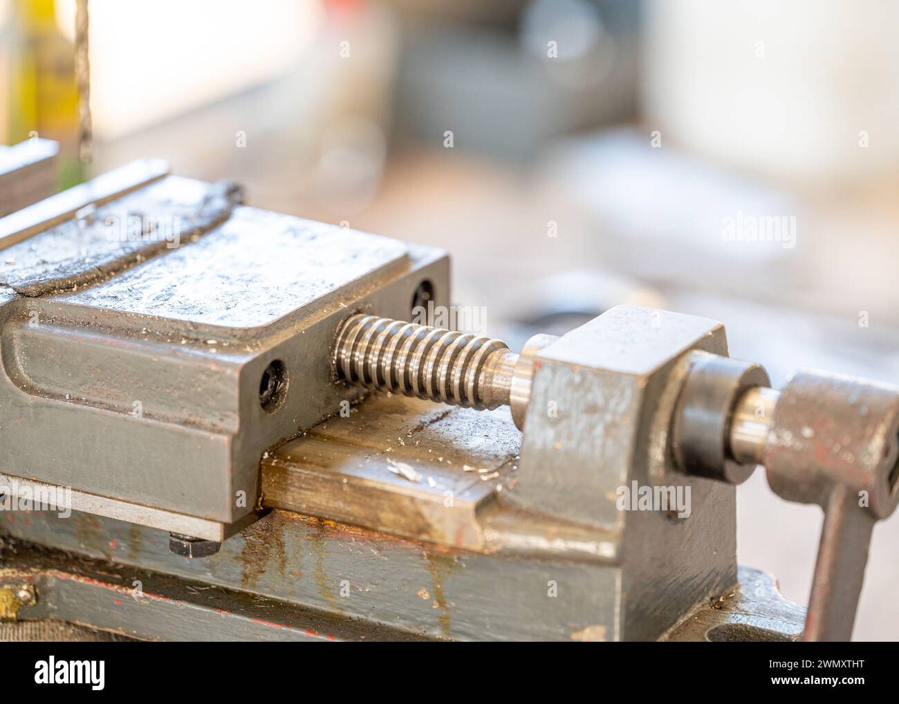 The CNC lathe machine mills slotted spindle parts made of brass and ...