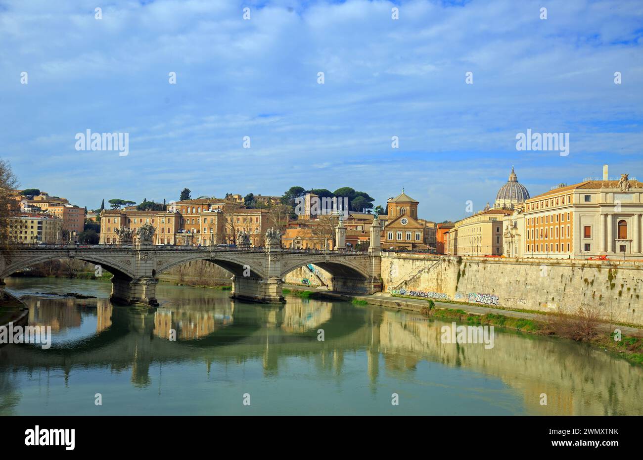 Scenic view over the River Tiber with reflection of arched bridge and ...