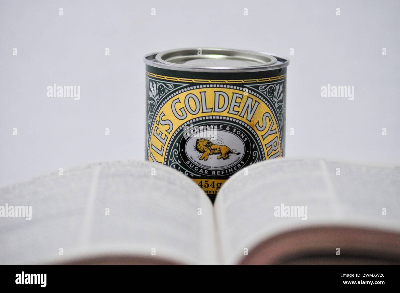 A tin of Lyle's Golden Syrup behind an open bible on the story of ...