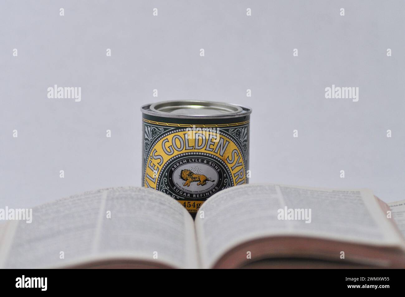A tin of Lyle's Golden Syrup behind an open bible on the story of ...