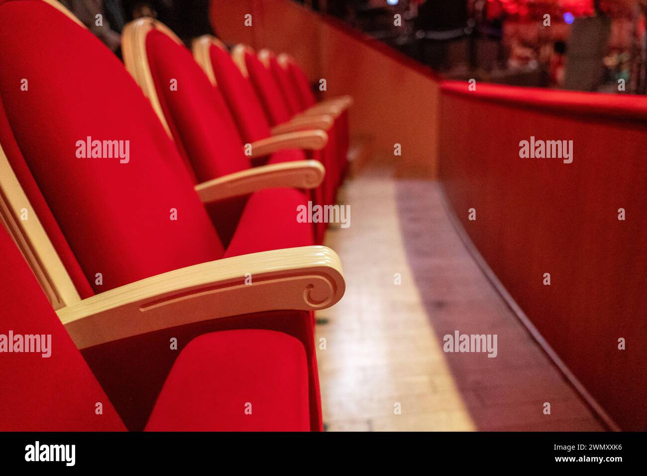 rows of empty spectator seats in a circus or theater. red upholstered ...