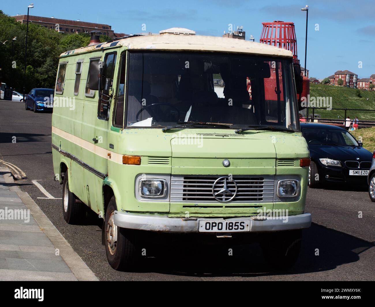 A 1977 lime green 'Mercedes Benz 608D' camper van with a distinctive ...