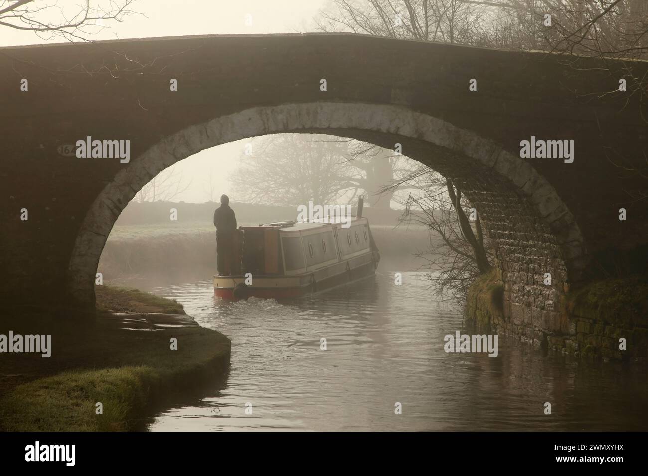 Narrow boat passing under Newton Bridge (no. 164) over the Leeds ...