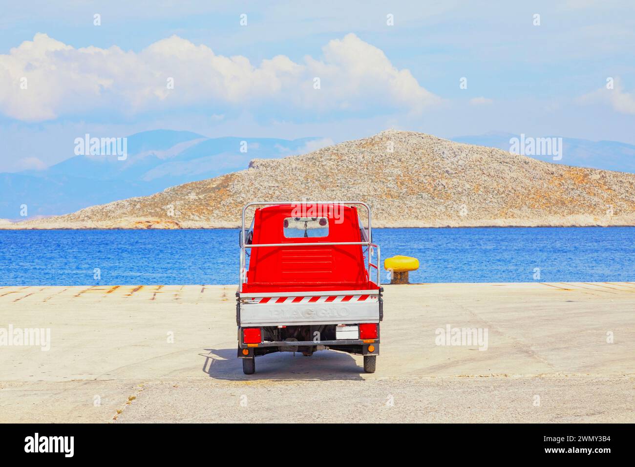 Greece, Dodecanese islands, Halki island, Three-wheeled vehicle parked ...