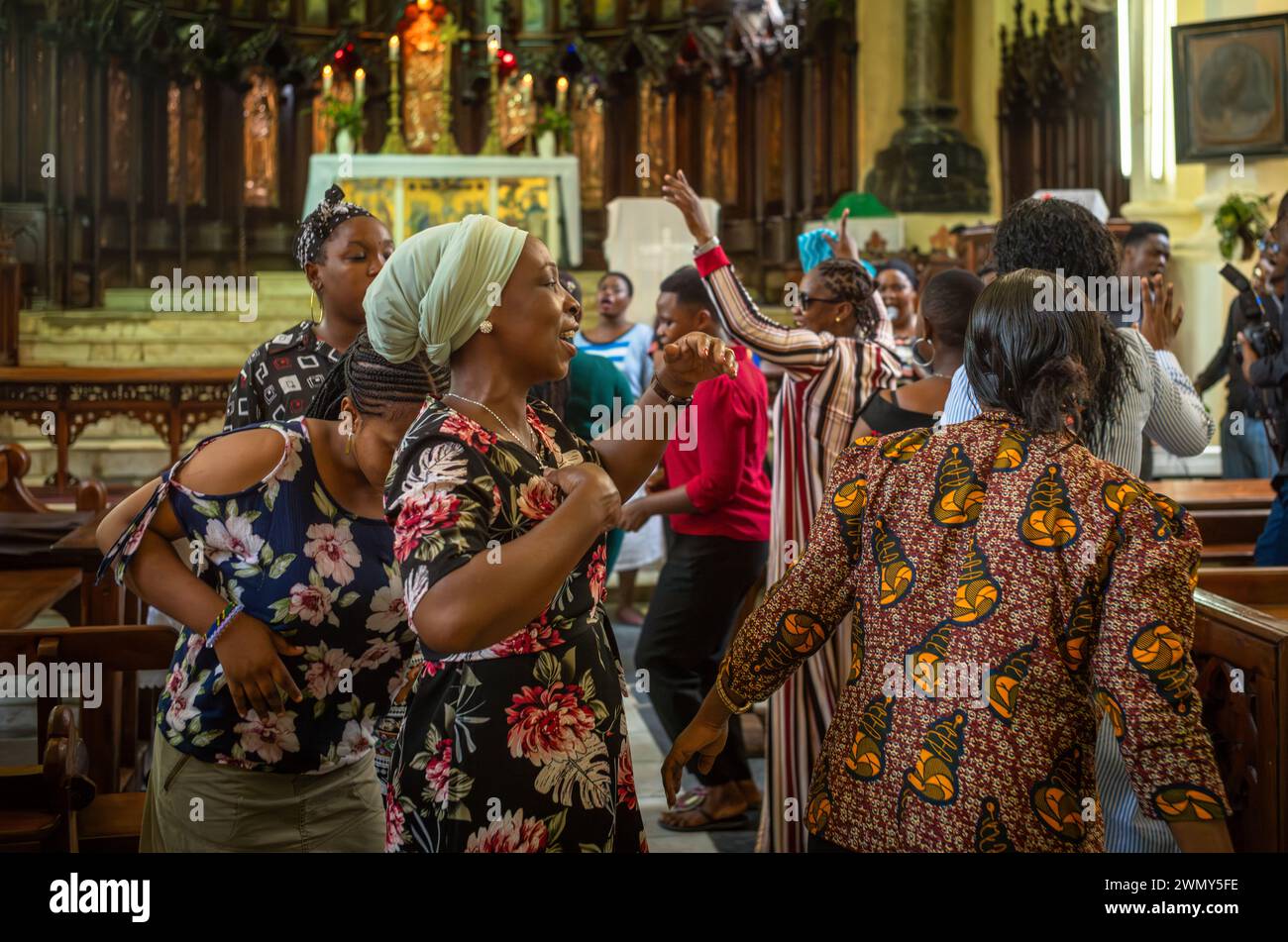 Women worshippers sing, dance and pray on a Sunday inside the Anglican ...