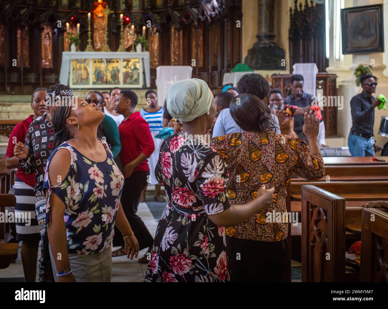 Women worshippers sing, dance and pray on a Sunday inside the Anglican ...