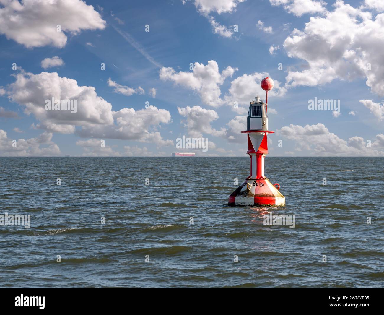 Red-white navigation buoy Otzumer Balje in German Bight north of East ...