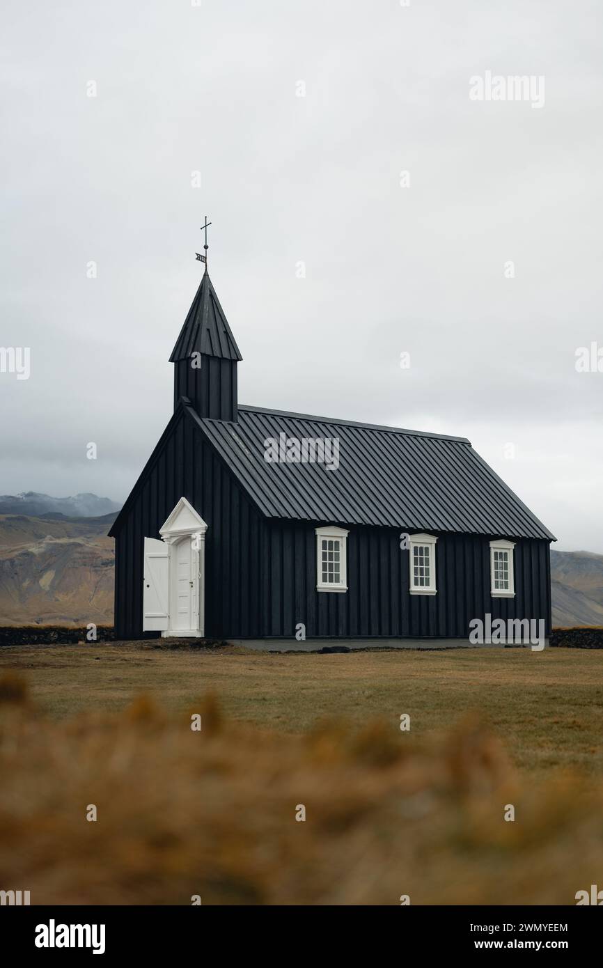 The iconic Black Church of Budir stands against the dramatic backdrop ...