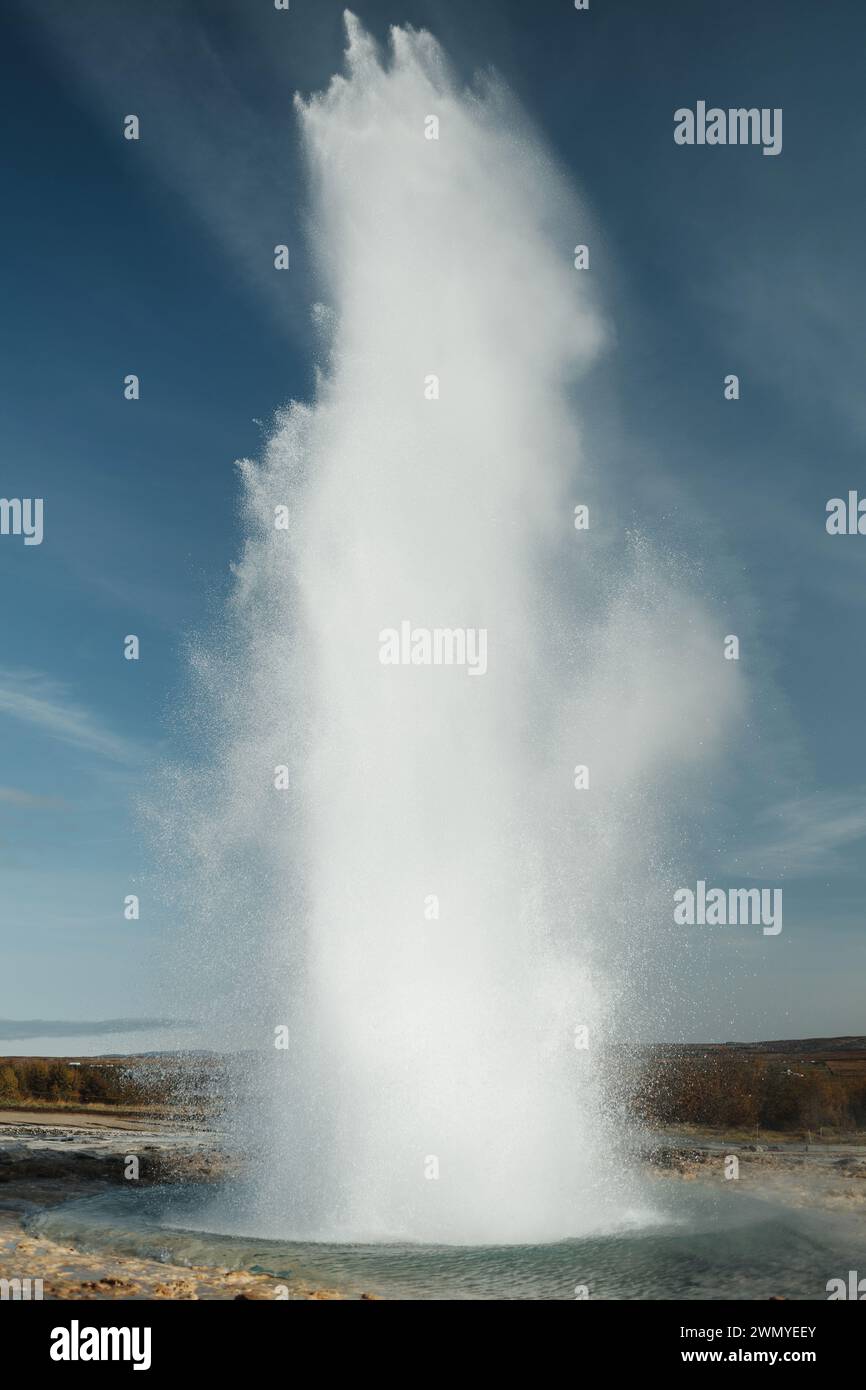 The Strokkur Geyser in Iceland erupts with force, shooting a column of ...