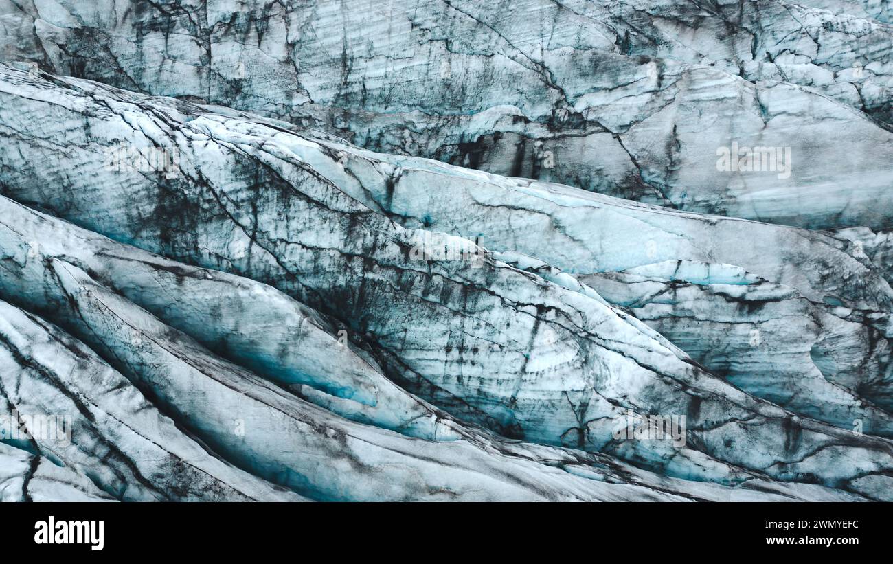 Stunning close-up of the blue ice and crevasses of a glacier in Iceland ...