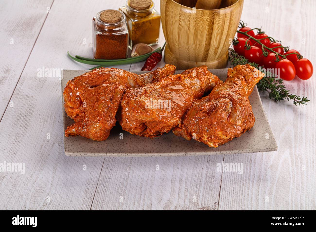 Raw turkey shoulder wing in Indian tandoori marinade spices Stock Photo ...