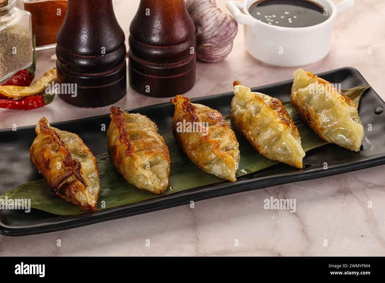 Fried Japanese stuffed dumplings - Gyoza with meat Stock Photo - Alamy