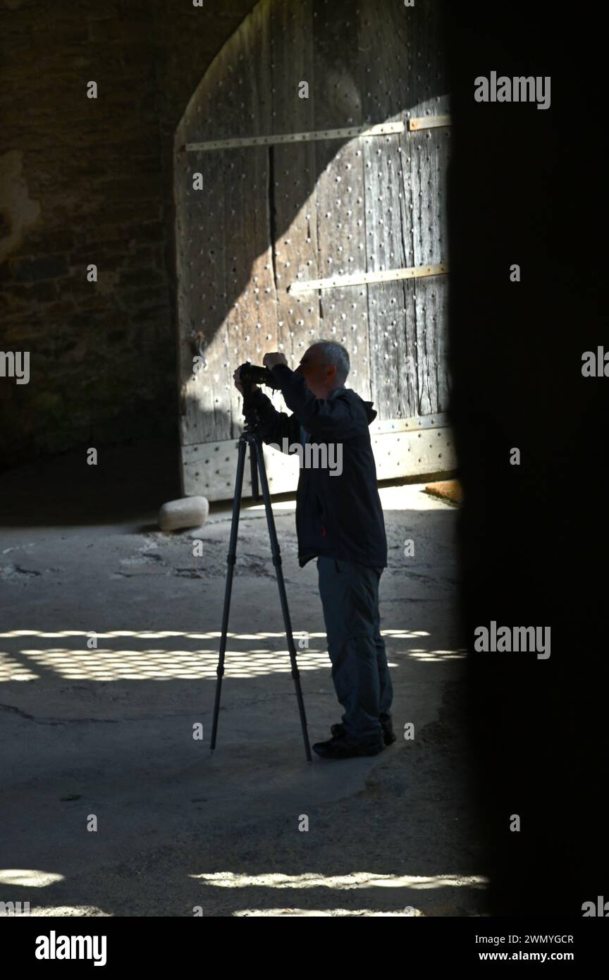 photographer at work inside the great hall of Stokesay Castle ...