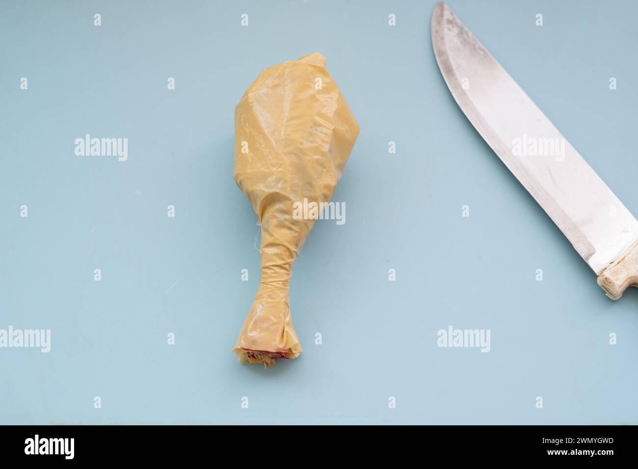 An artful display of a chicken drumstick made from a plastic bag ...