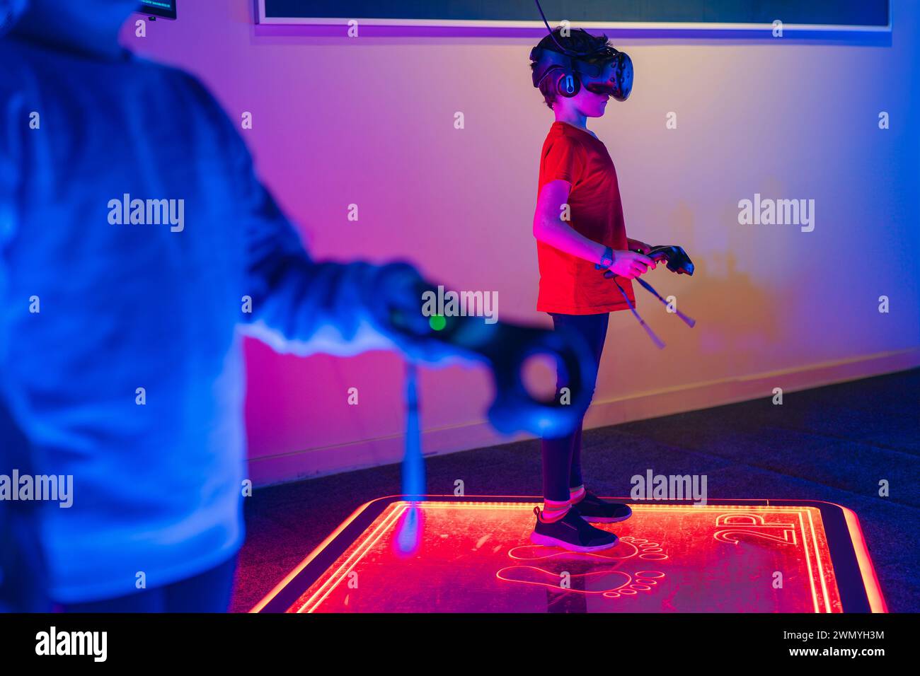 Anonymous players in VR headsets engaging with virtual reality games on ...