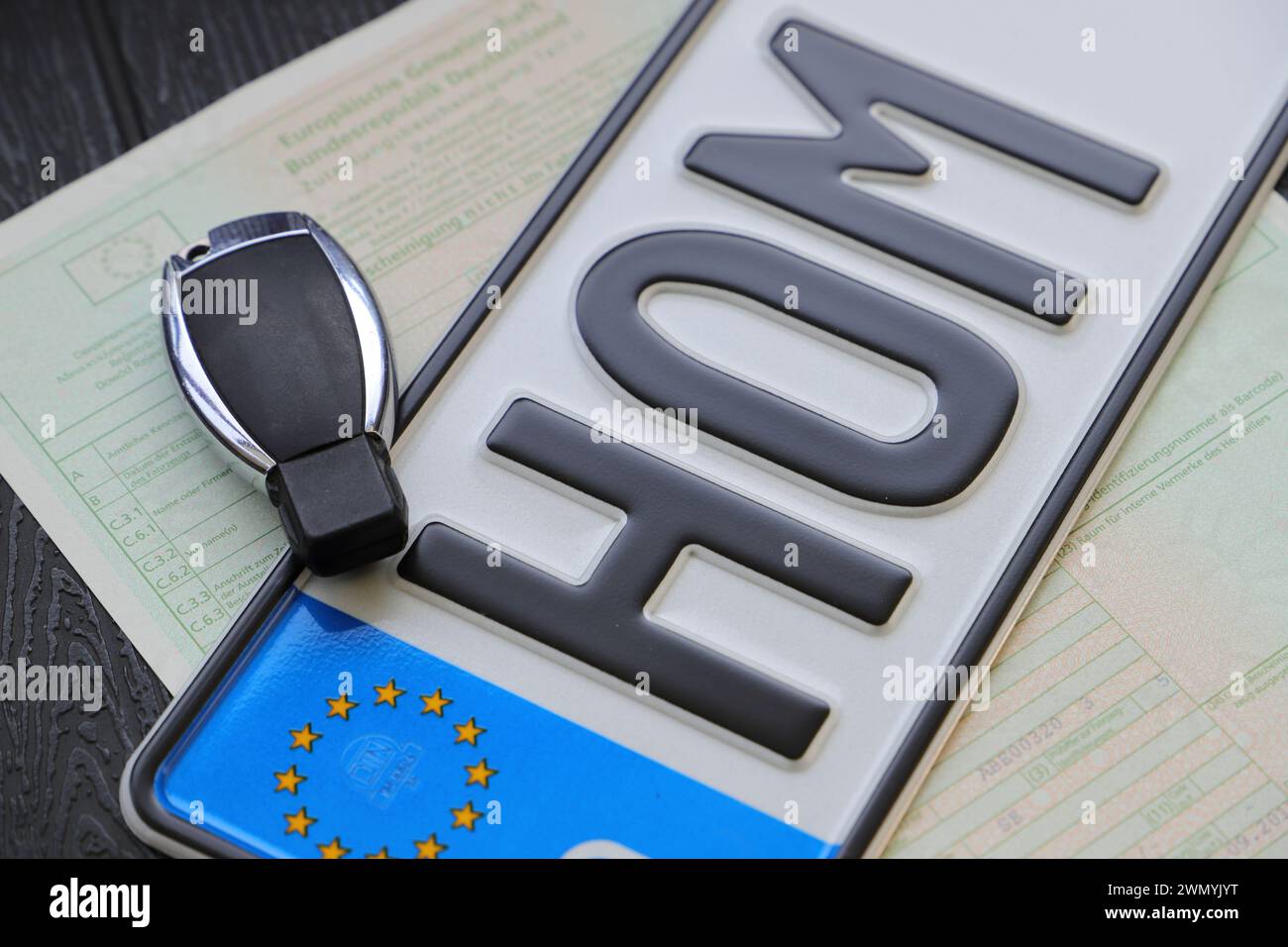 License plate with a car key Stock Photo - Alamy