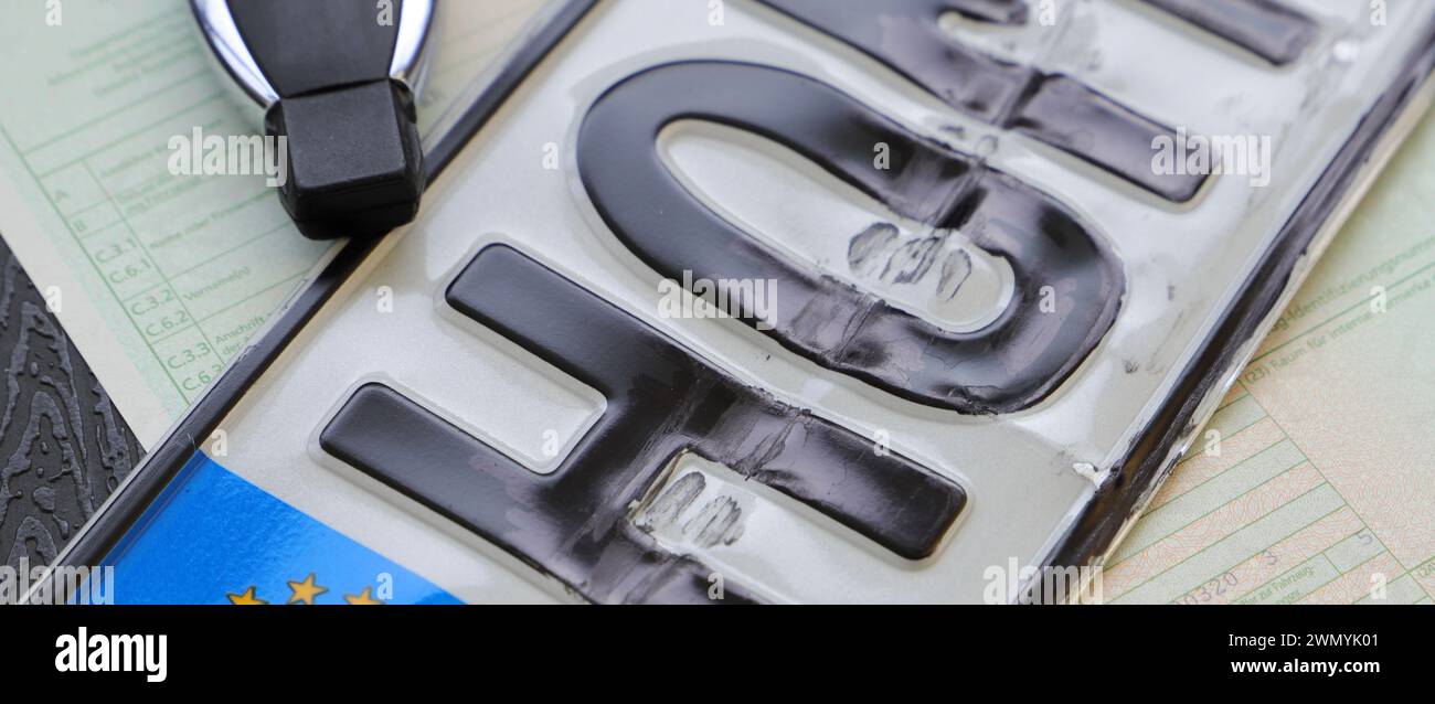 a broken license plate with car keys after an accident Stock Photo - Alamy