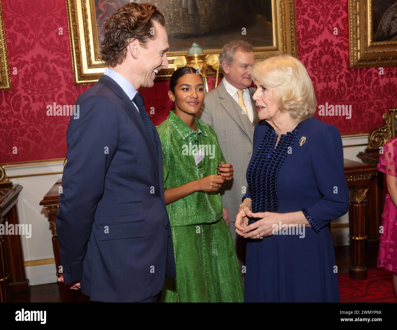 Queen Camilla speaks with Tom Hiddleston, Olivia Dean and Hugh ...