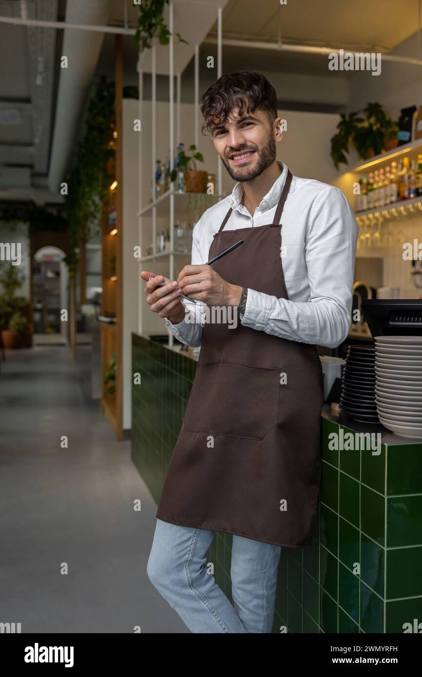 Waiter writing down an order hi-res stock photography and images - Alamy
