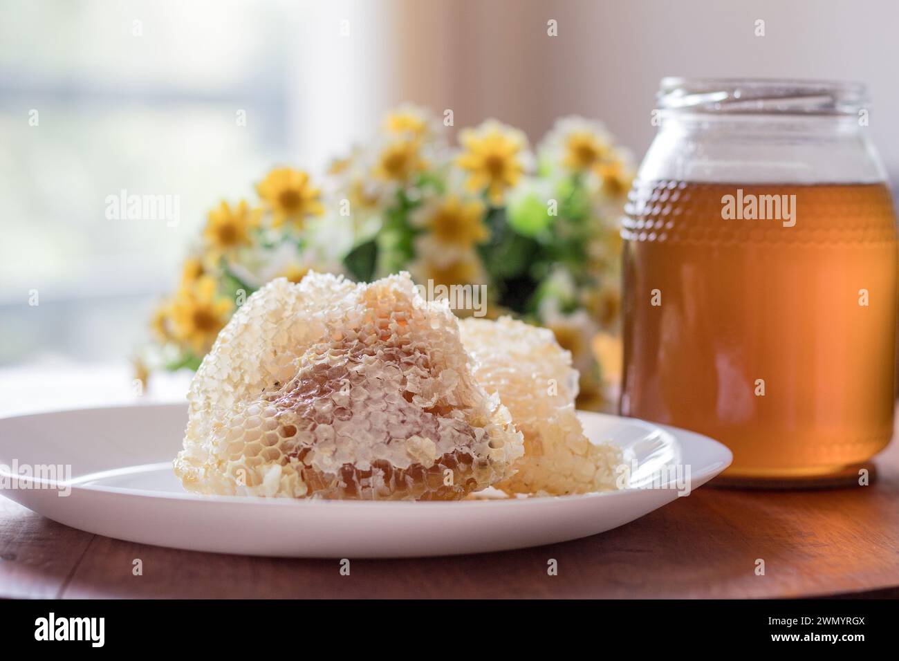 Fresh honey jar with flowers and honeycomb, delicious biological ...