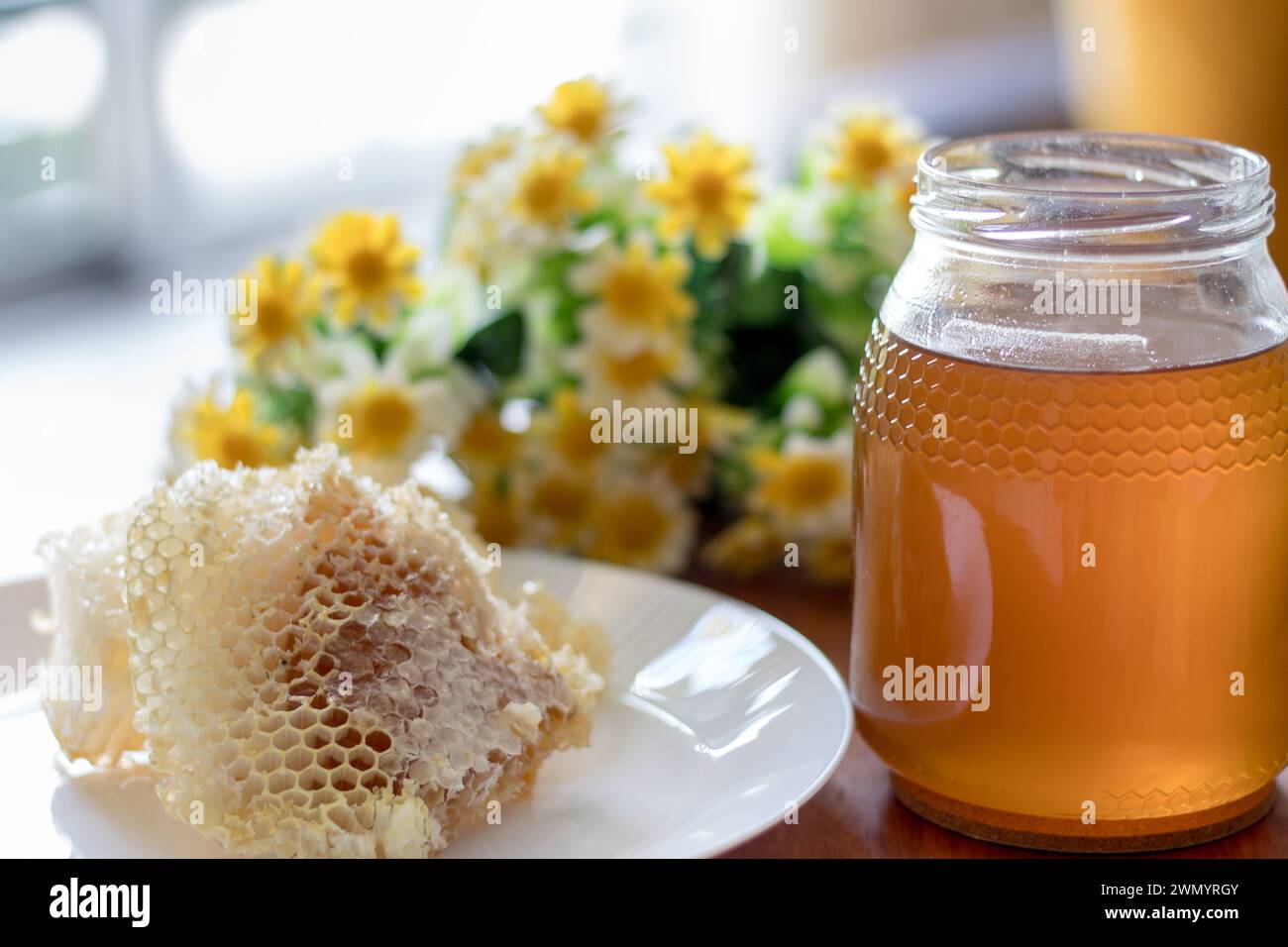 Fresh honey jar with flowers and honeycomb, delicious biological ...