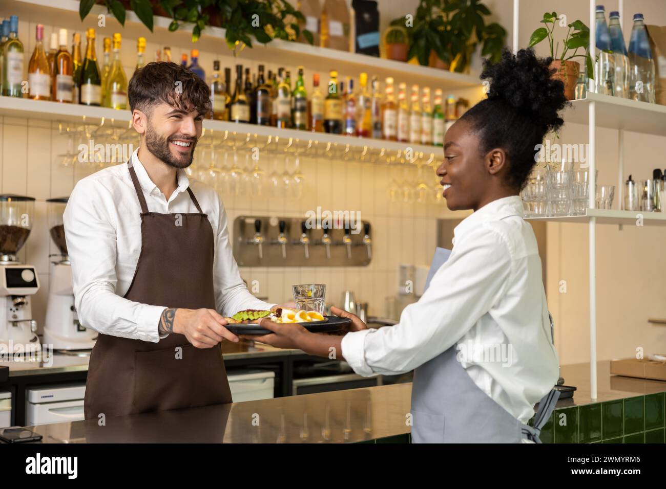 Happy customers giving order hi-res stock photography and images - Alamy