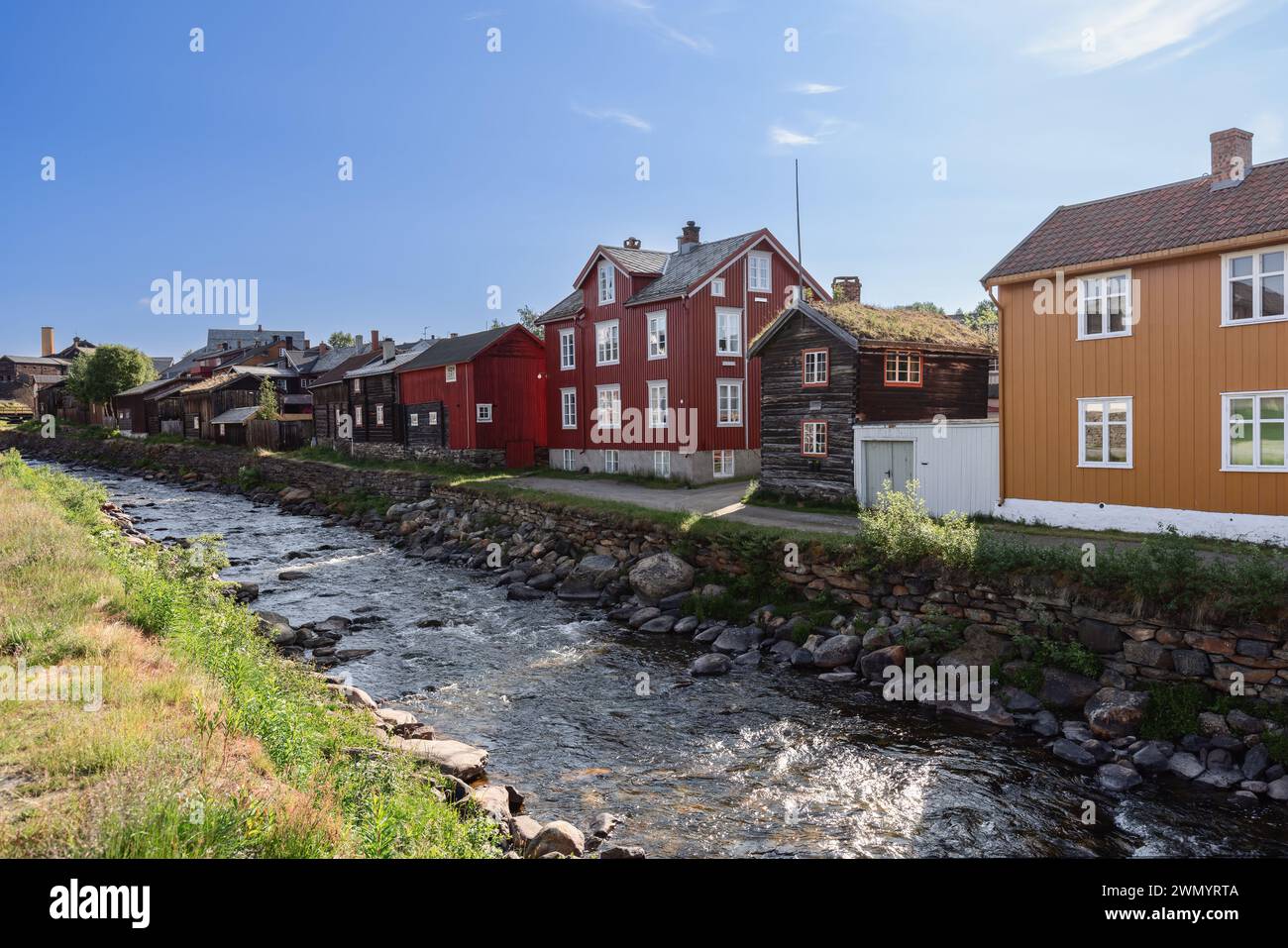 The Glomma River flows steadily through Roros, with vibrant Norwegian ...