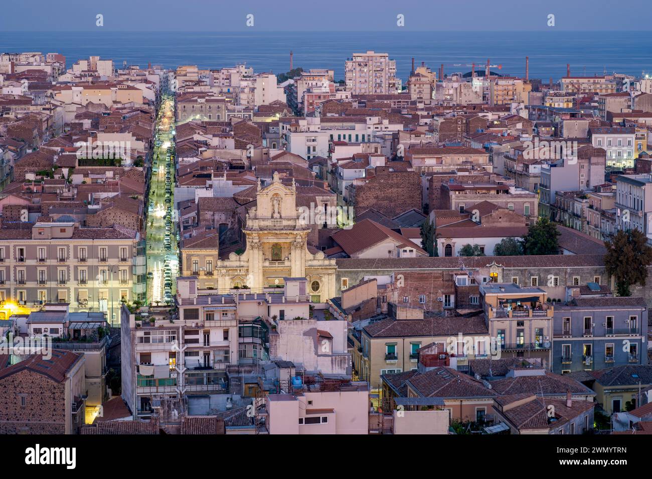 The sunset light on the buildings in the center of the city of Catania ...