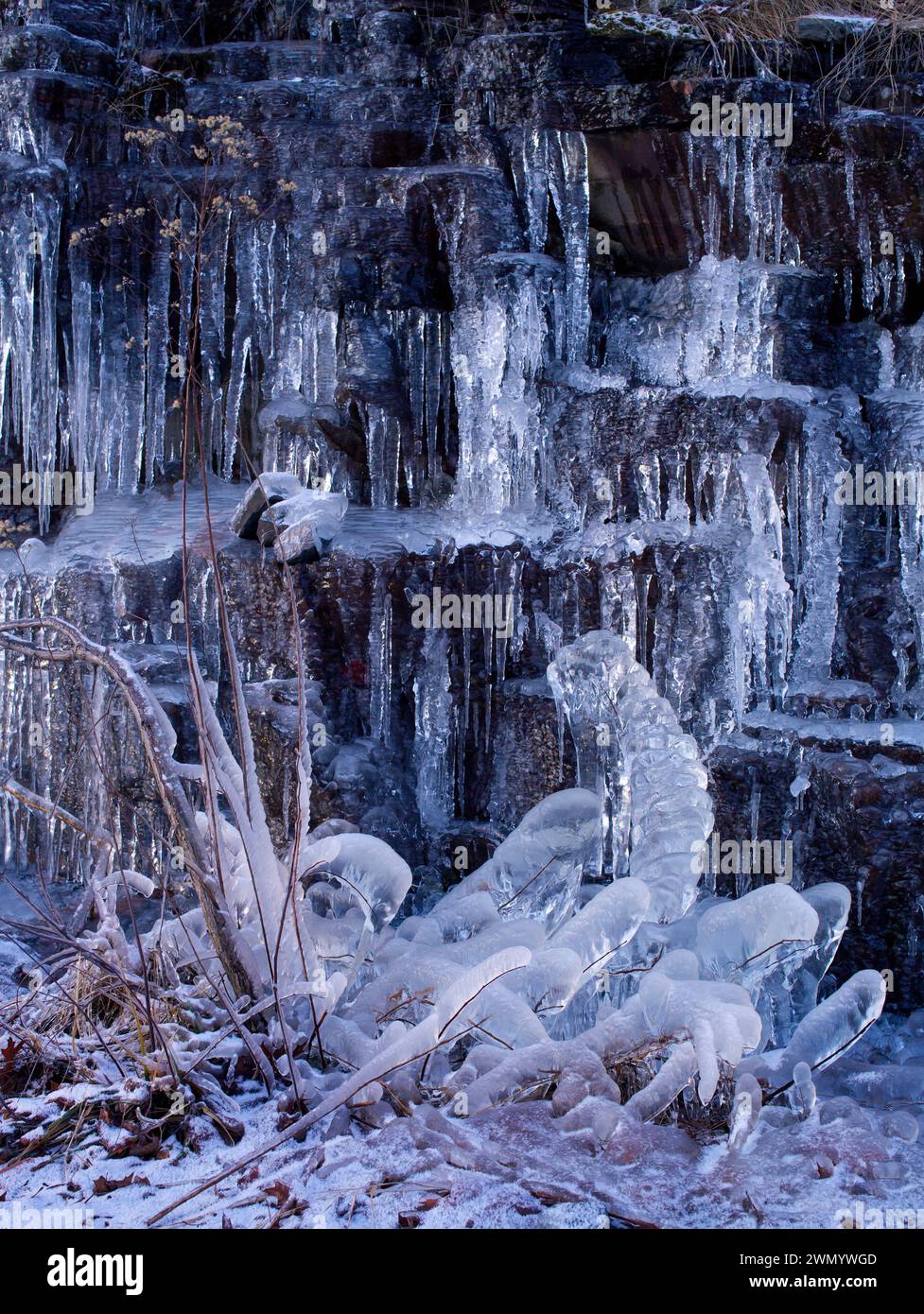 Frozen ice cycles hanging from rocks Stock Photo - Alamy