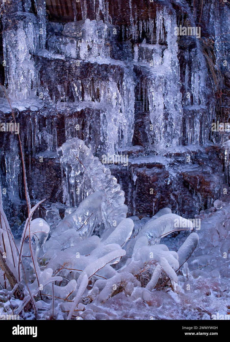 Frozen ice cycles hanging from rocks Stock Photo - Alamy