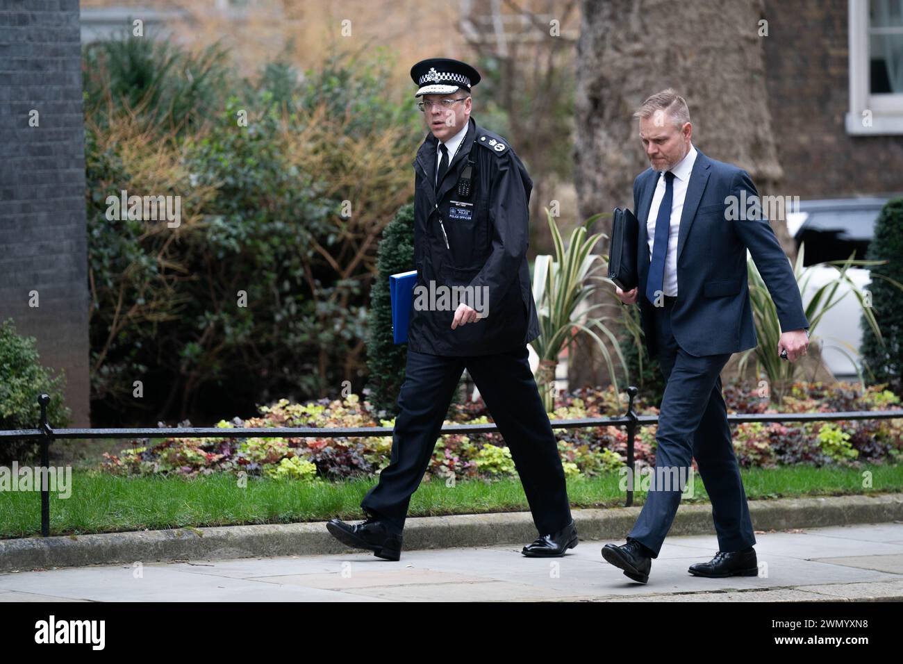 Assistant Commissioner Matt Twist (left) arrives at 10 Downing Street ...