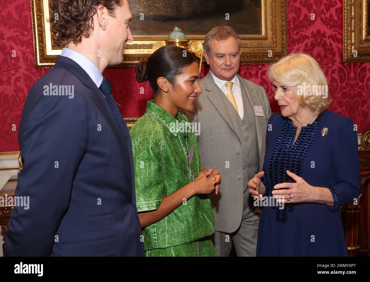 Queen Camilla speaks with Tom Hiddleston, Olivia Dean and Hugh ...