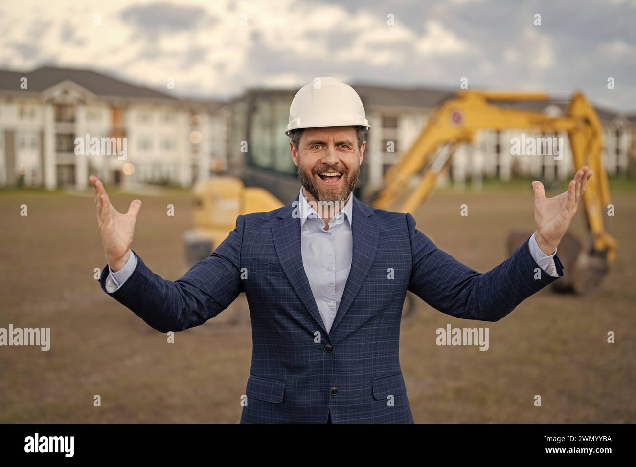 photo of glad successful construction business owner wearing hardhat ...