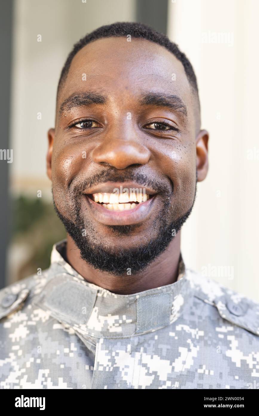 African American soldier smiles warmly, wearing a military uniform ...