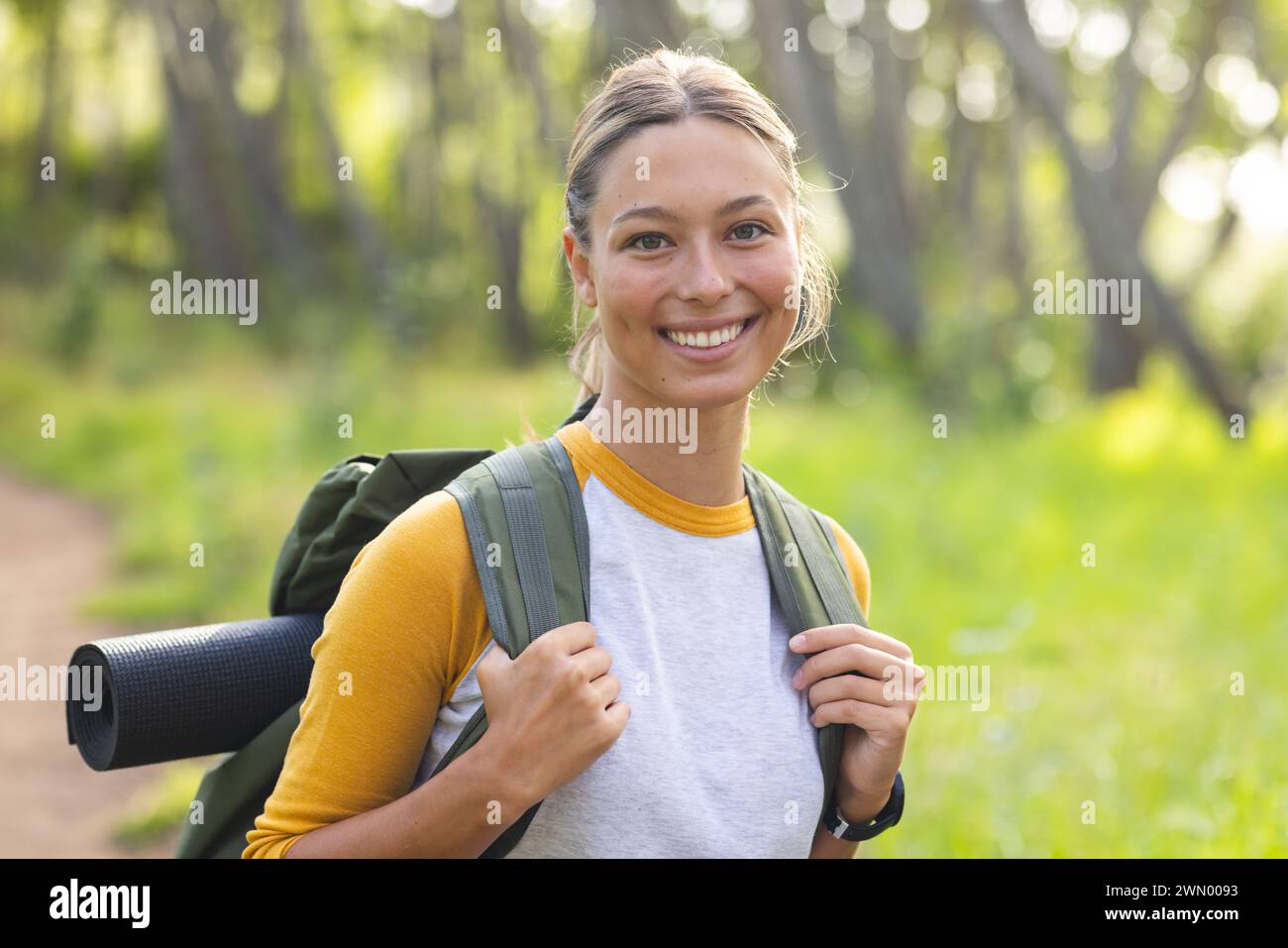 Attractive young woman smiles hiking hi-res stock photography and ...