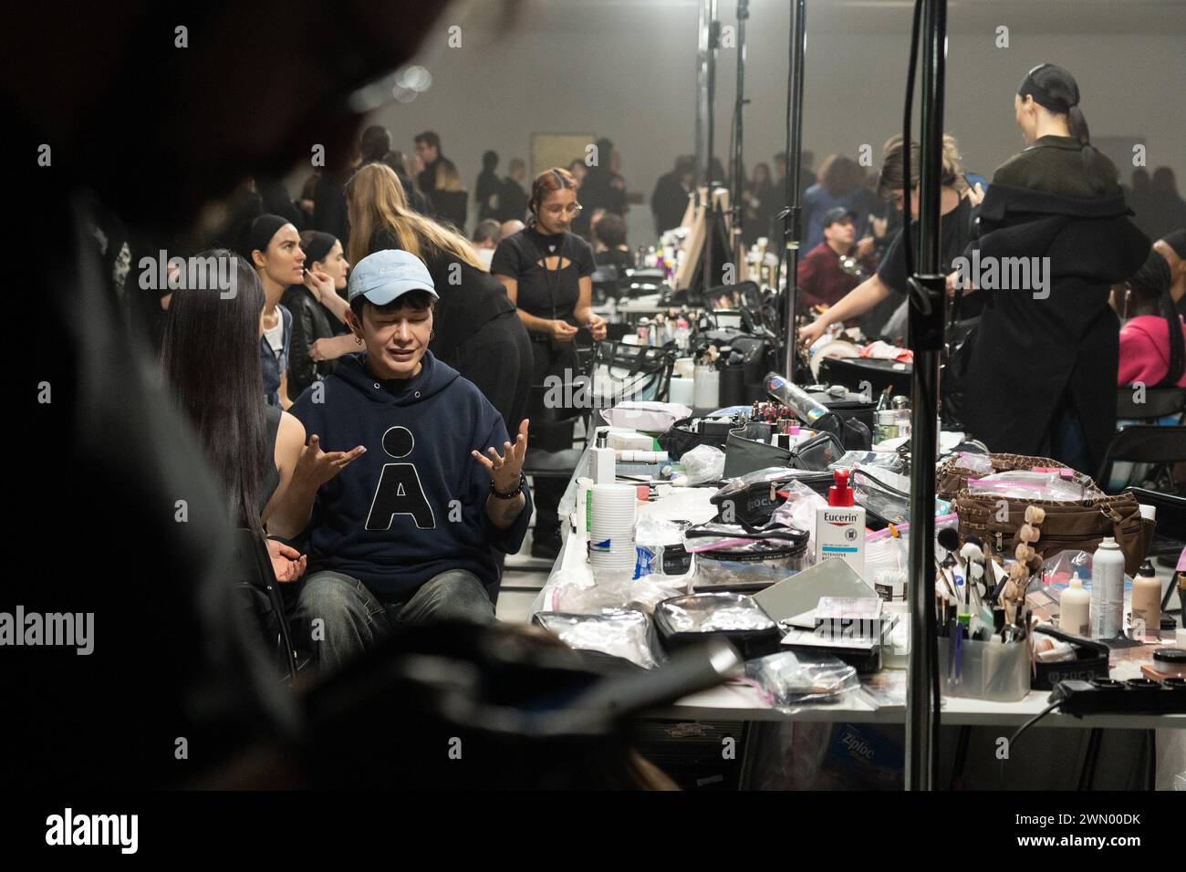 Models prepare to walk the runway a few minutes to the start of Maison ...