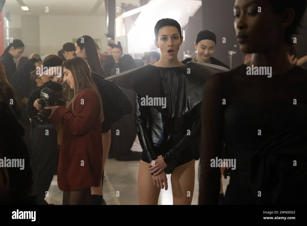 Models prepare to walk the runway a few minutes to the start of Maison ...