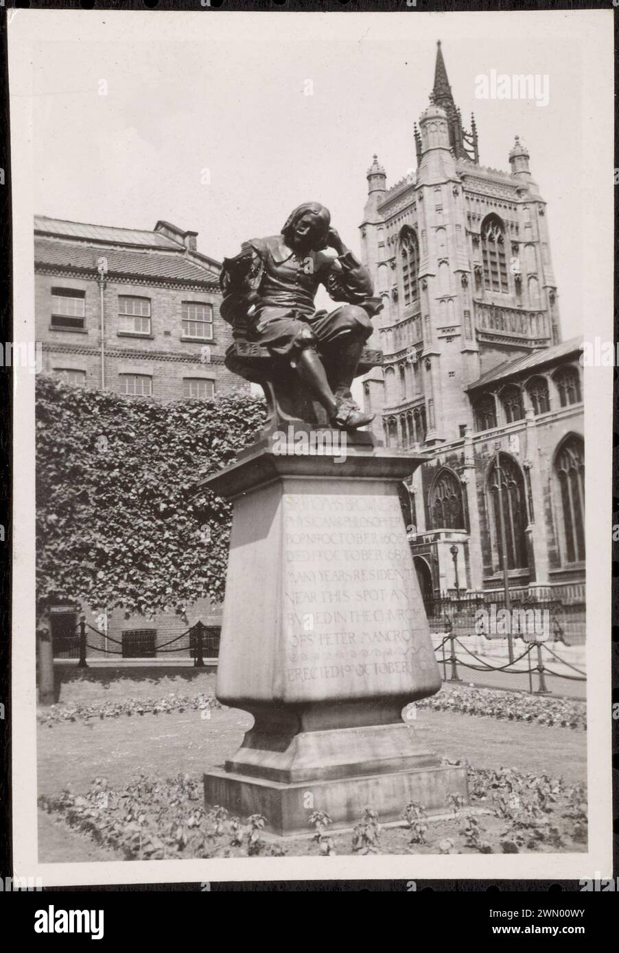 Statue of a man sitting with head in hand. Statue of a man sitting with ...