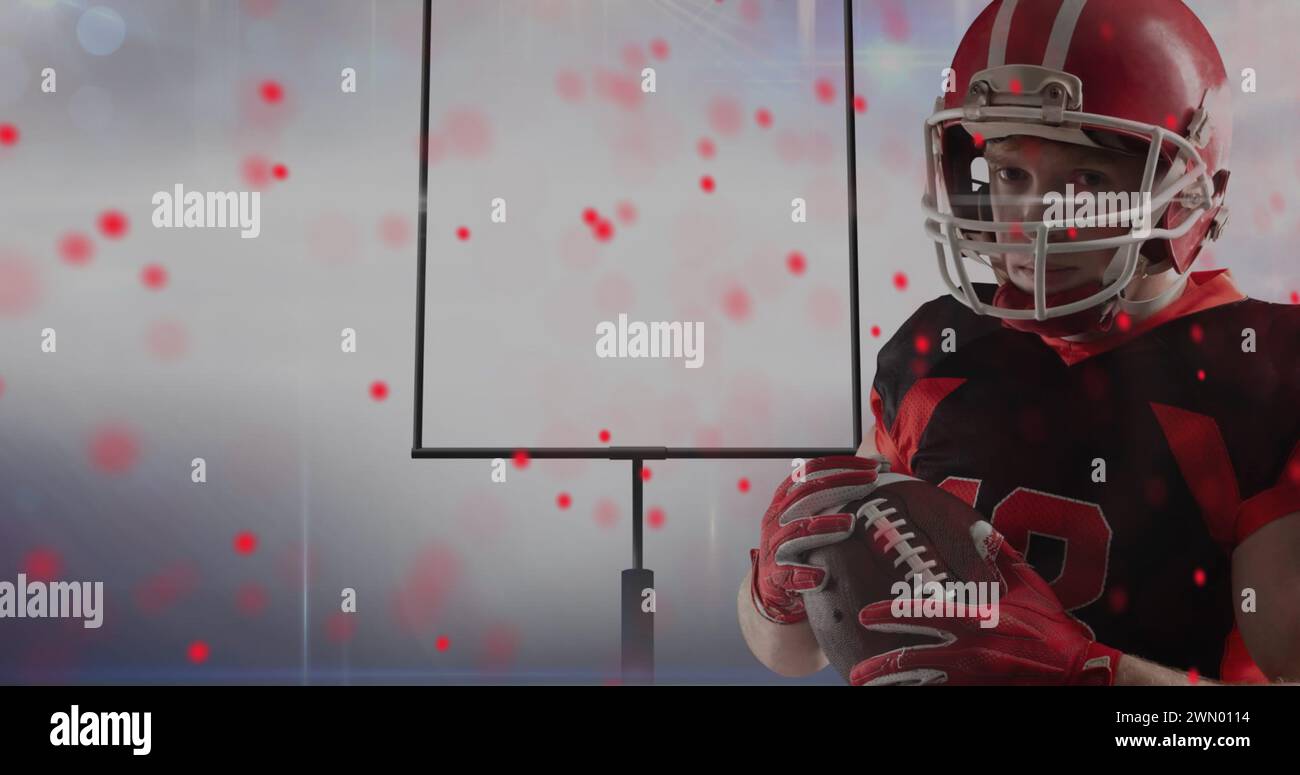 Image of red spots over male american football player with ball Stock ...