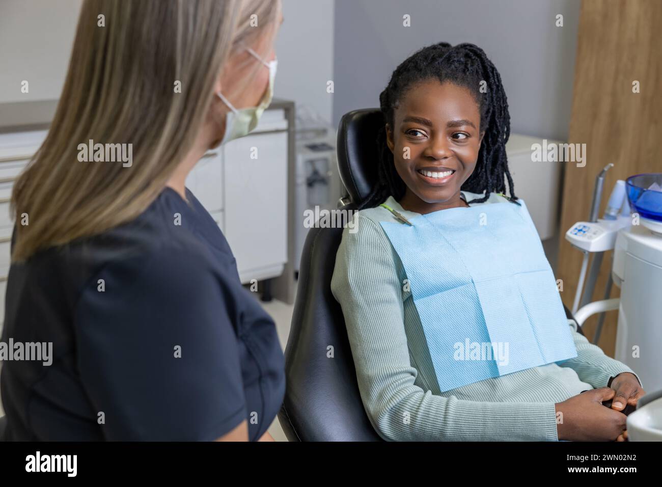 Multicultural lady in dental clinic doing teeth checkup Stock Photo - Alamy