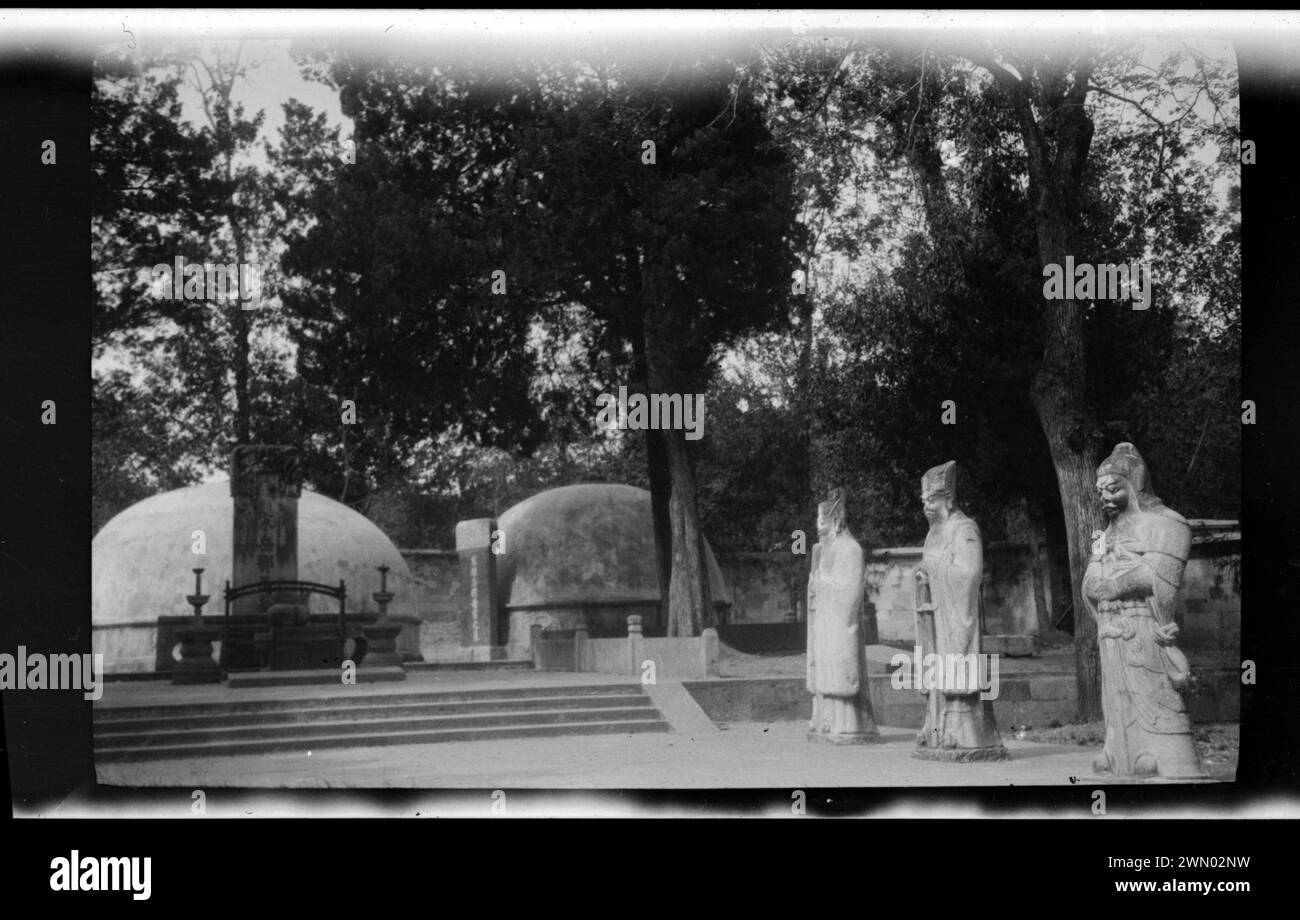 Statues in row, trees and wall in background. Statues in row, trees and ...